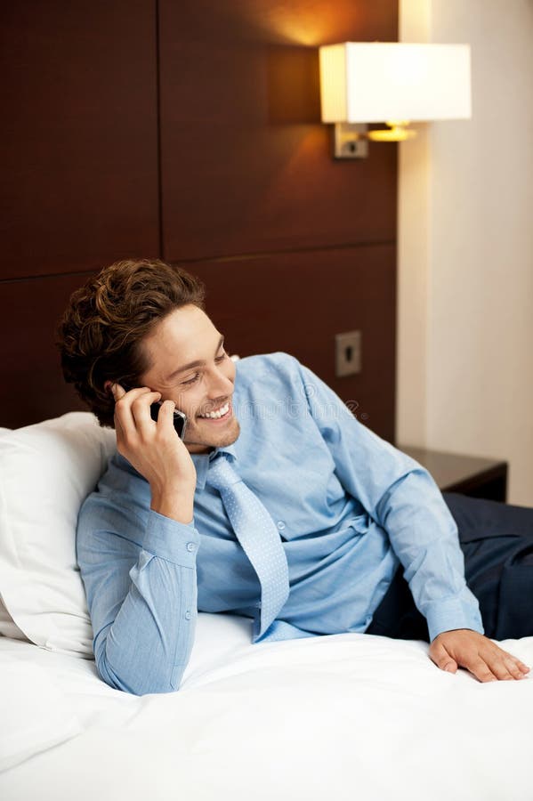 Delighted Young Man Communicating with His Partner Stock Photo - Image ...