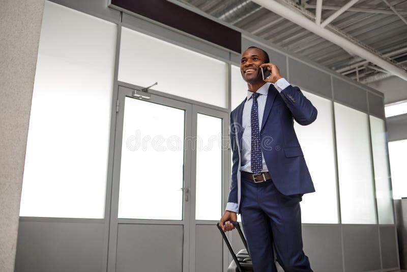 Delighted Young Manager is Having Pleasant Conversation on Mobile Phone ...