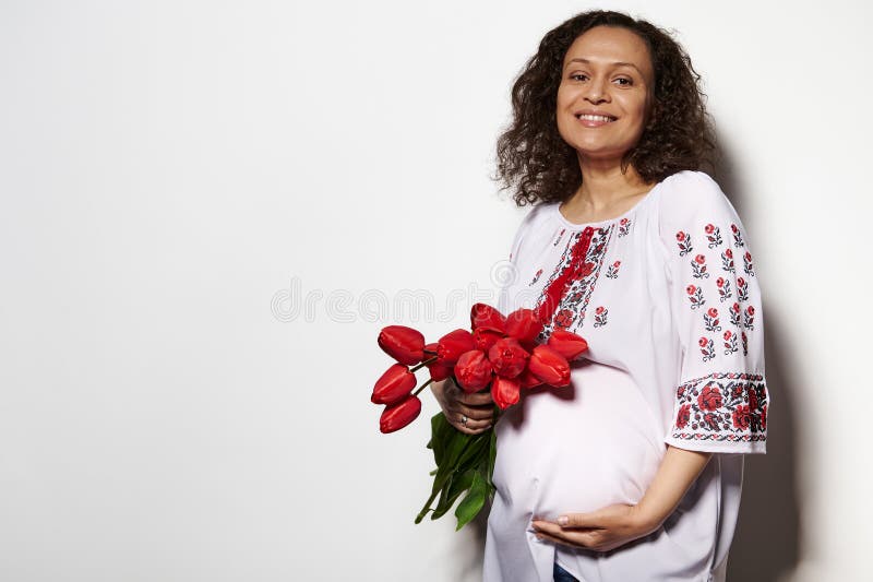 Delightful Adult Pregnant Woman In Ukrainian Ethnic Embroidered Shirt