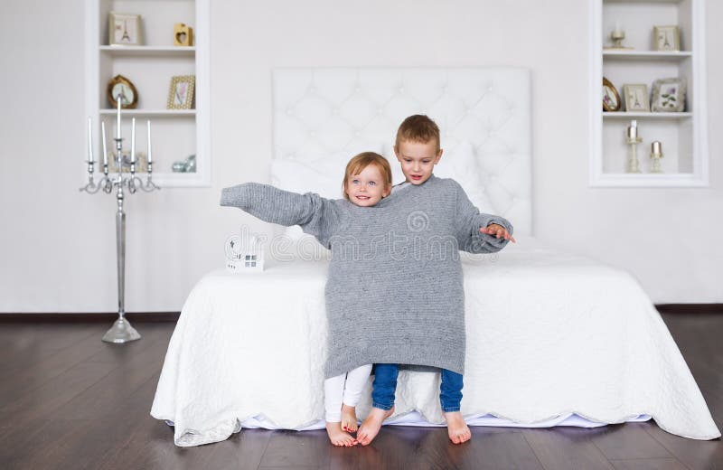 Delightful Little Children in Big Grey Sweater. Stock Photo - Image of ...