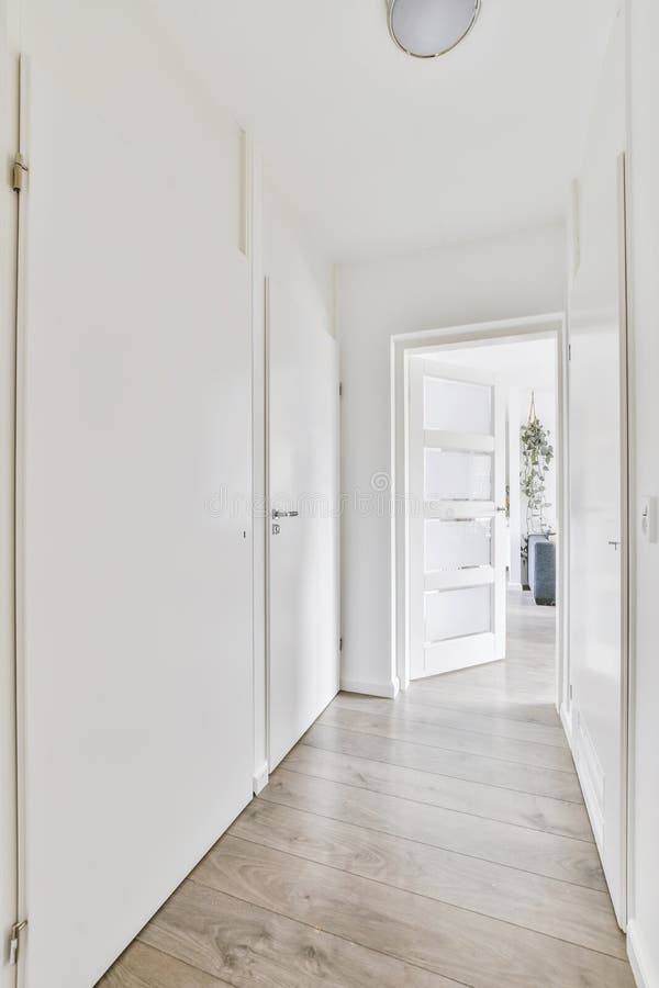 Delightful Long Light Corridor with an Open Door Stock Image - Image of ...