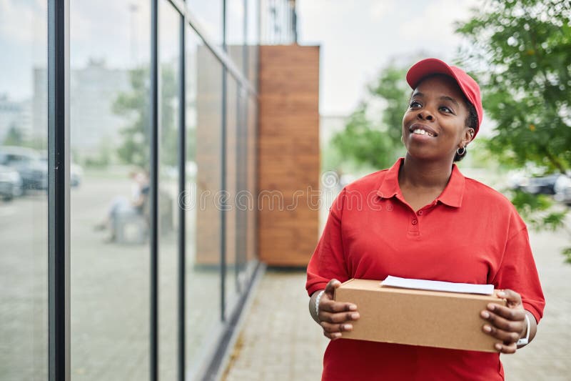 Delivering Package in Outdoor Urban Setting Wearing Cap Stock Image ... Delivering Package in Outdoor Urban Setting Wearing Cap Stock Image ...