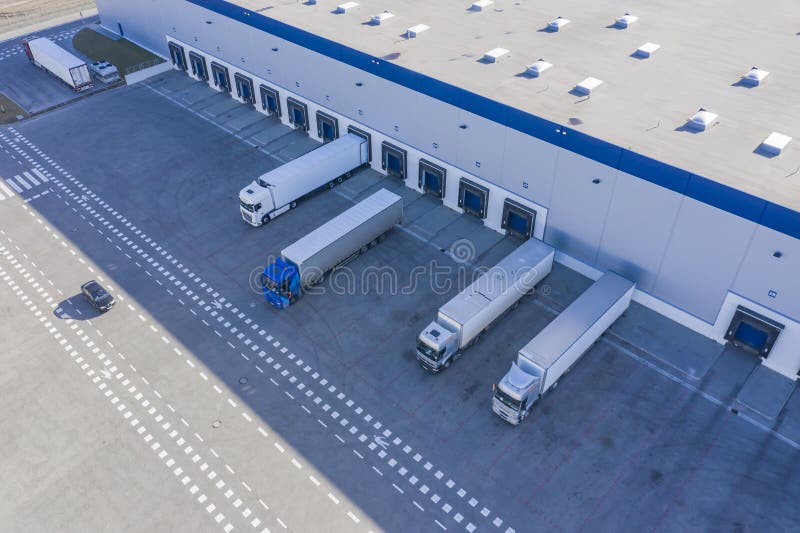 Delivering or Supply Concept Image. Trucks Loading at Facility ...
