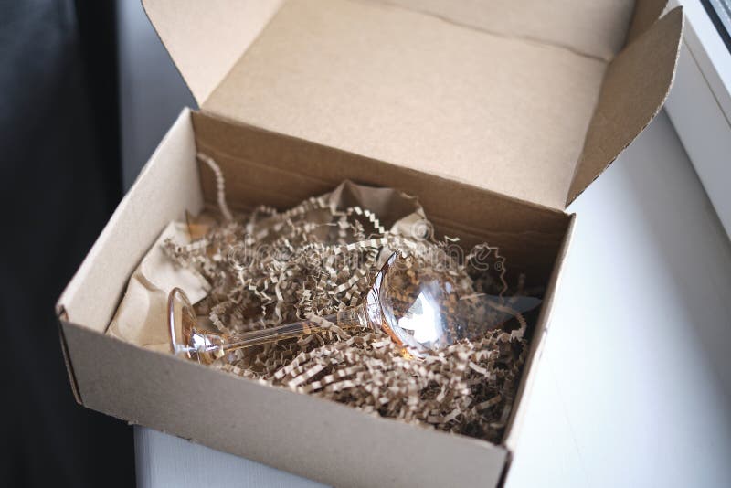 Delivery Box from a Store and Discovers a Broken Glass. an Improperly ...