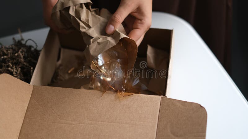 Delivery Box from a Store and Discovers a Broken Glass. an Improperly ...