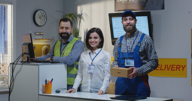 Delivery Center Employees Standing by Desk Stock Image - Image of ...
