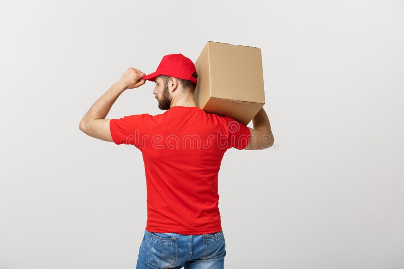 Delivery Concept - Back View of Handsome Caucasian Delivery Man with ...