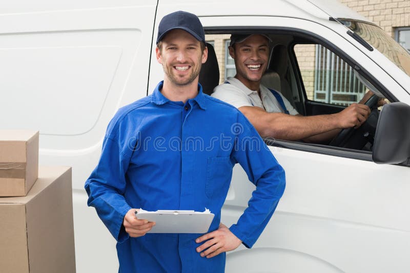 Delivery Driver Checking His List on Clipboard with Client Stock Photo ...
