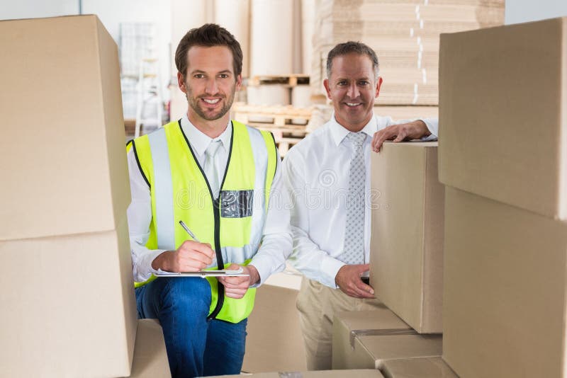 Delivery Driver Checking His List on Clipboard Stock Image - Image of ...