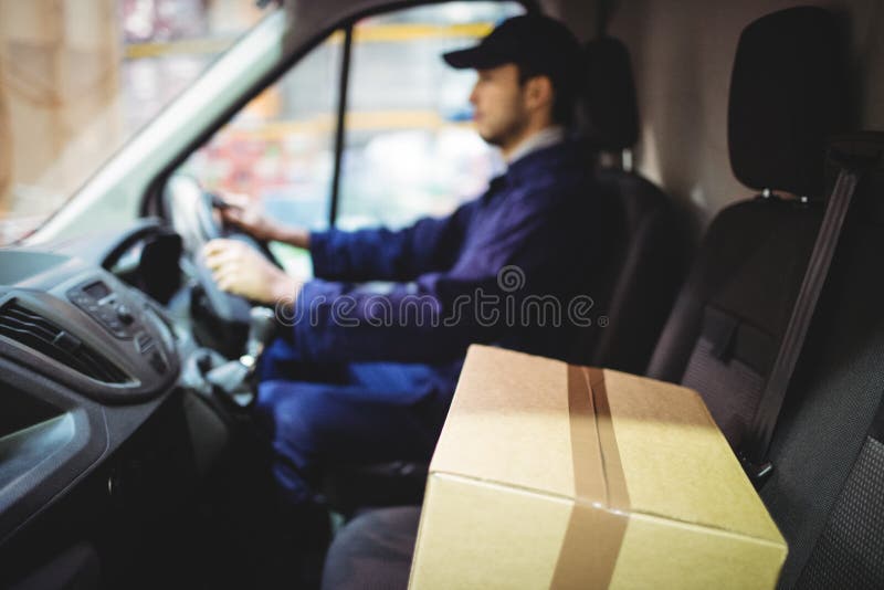 Delivery Driver Driving Van with Parcels on Seat Stock Photo - Image of ...