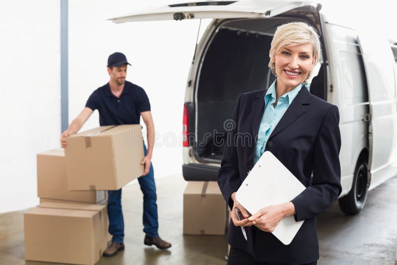 Delivery Driver Packing His Van with Manager Smiling Stock Image ...