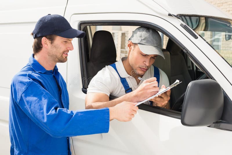 Delivery Driver Signing on the Clipboard Stock Image - Image of ...