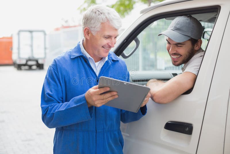 Delivery Driver Smiling at Camera with Customer Stock Image - Image of ...