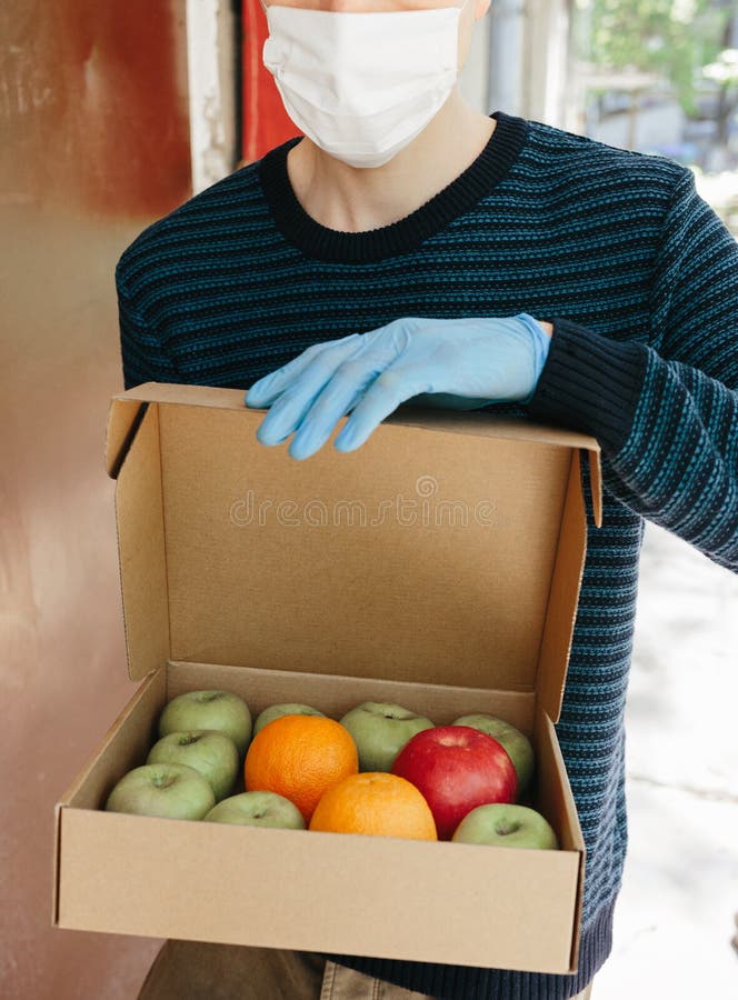 Delivery Fruit Service, Courier in Protective Mask and Medical Gloves ...