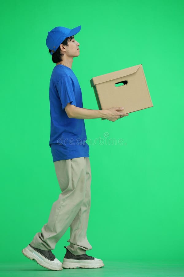 Delivery Guy Green Background Full Height Gives Box Stock Photos - Free ...