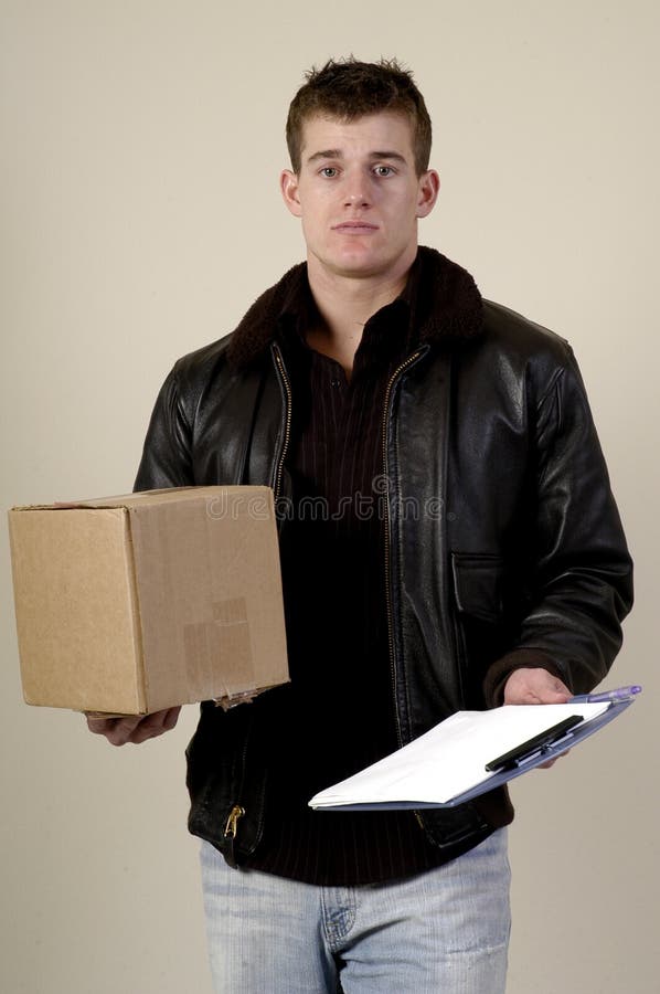 Delivery man stock photo. Image of invoice, jacket, young - 658406