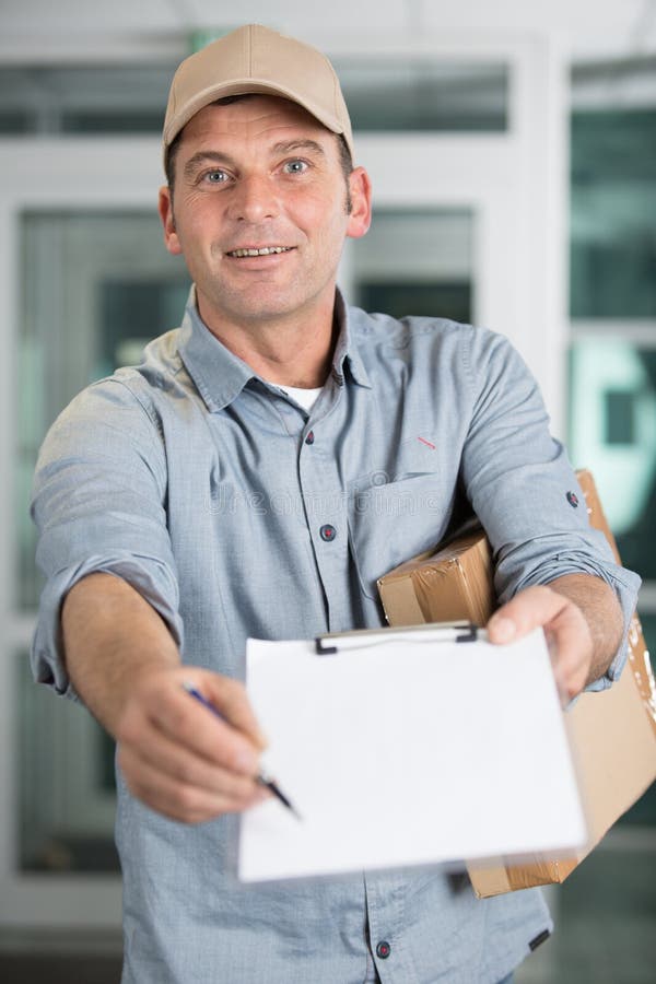 Delivery Man Ask To Sign Invoice Stock Image - Image of delivering ...