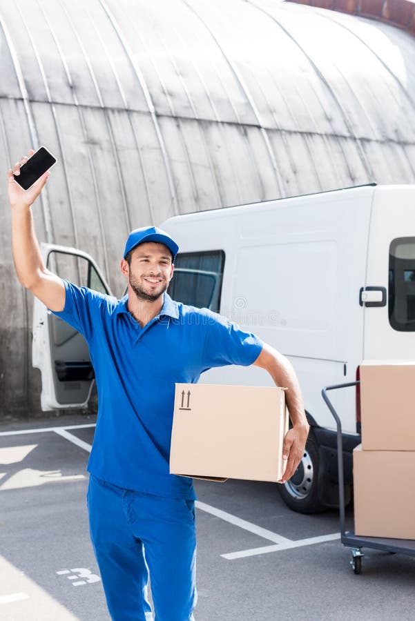 Delivery man with box stock photo. Image of cargo, delivery - 99748970