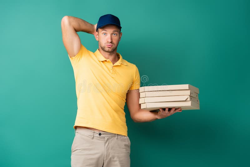 Delivery Man in Cap Holding Pizza Stock Photo - Image of pizza ...
