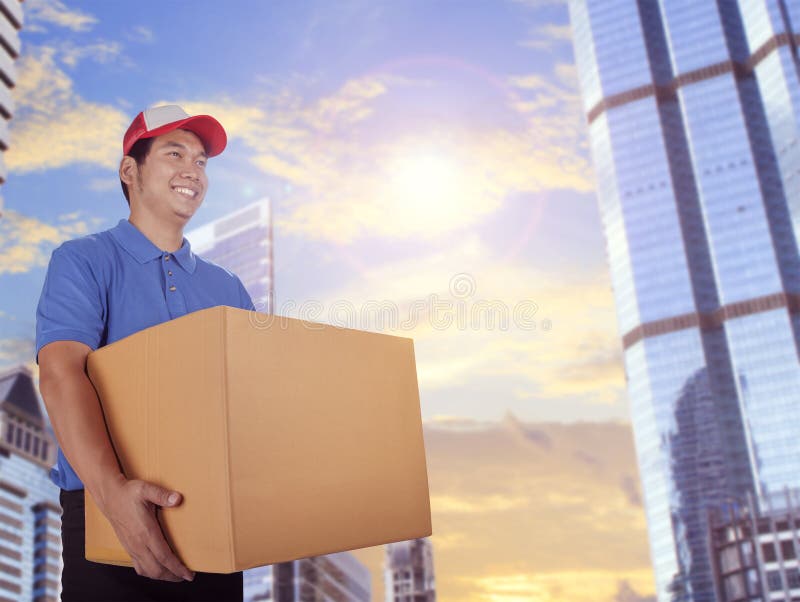 Delivery Man and Card Box Delivering in City Building Stock Photo ...