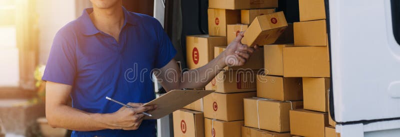 Delivery Man with Cardboard Box Checking Document List in Van and ...
