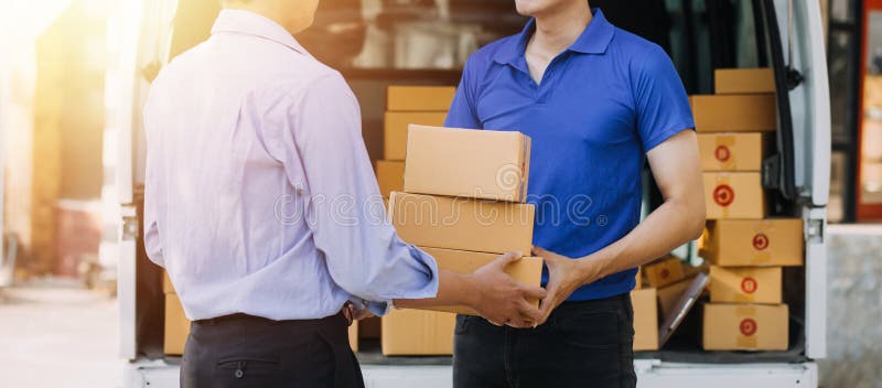 Delivery Man with Cardboard Box Checking Document List in Van and Parcels on Seat Outside the ...