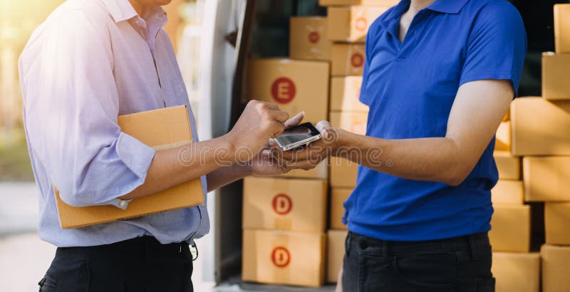 Delivery Man with Cardboard Box Checking Document List in Van and ...