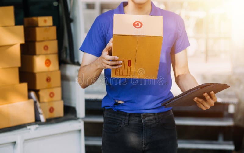 Delivery Man with Cardboard Box Checking Document List in Van and ...