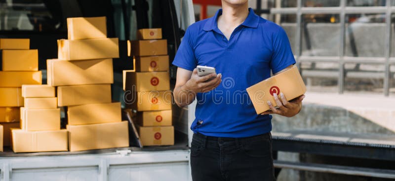 Delivery Man with Cardboard Box Checking Document List in Van and ...