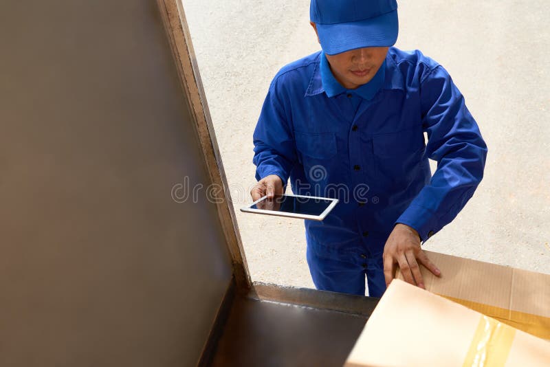 Delivery Man Checking Boxes Stock Image - Image of occupation, mailman ...