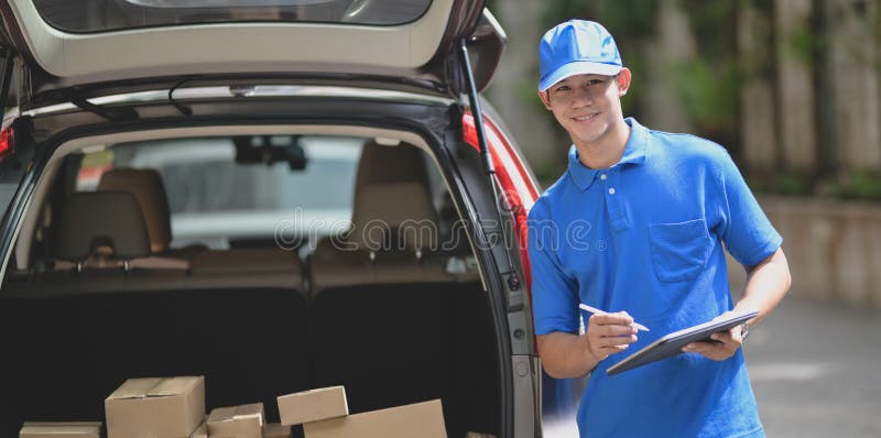 Delivery Man Checking Orders for Customer and Smiling To the Camera ...