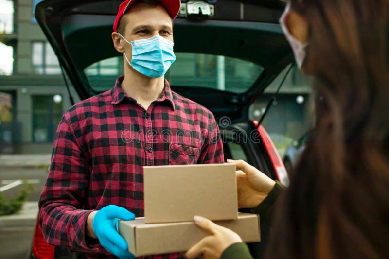 Delivery Man Courier with Package Post Box in Uniform Stock Photo ...