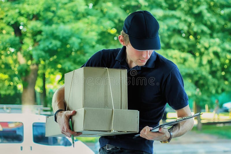 Delivery Man Delivering Package Box To Homeowner Stock Photo - Image of ...