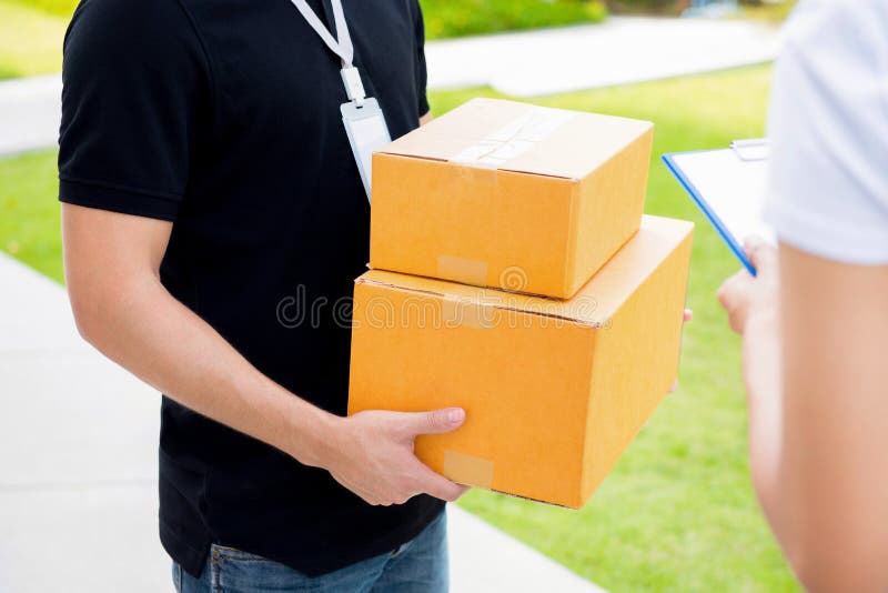 Delivery Man Delivering Packages To Recipient Stock Image - Image of ...