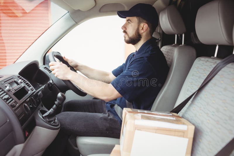 Delivery Man Driving His Van Stock Photo - Image of parcel, delivering ...