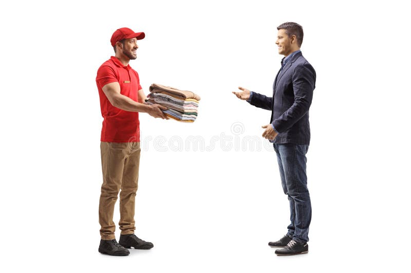 Delivery Man Giving a Pile of Folded Clothes To a Young Man Stock Photo ...