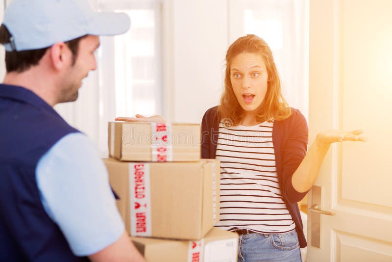 Delivery Man Handing Over a Parcel To Customer Stock Image - Image of ...