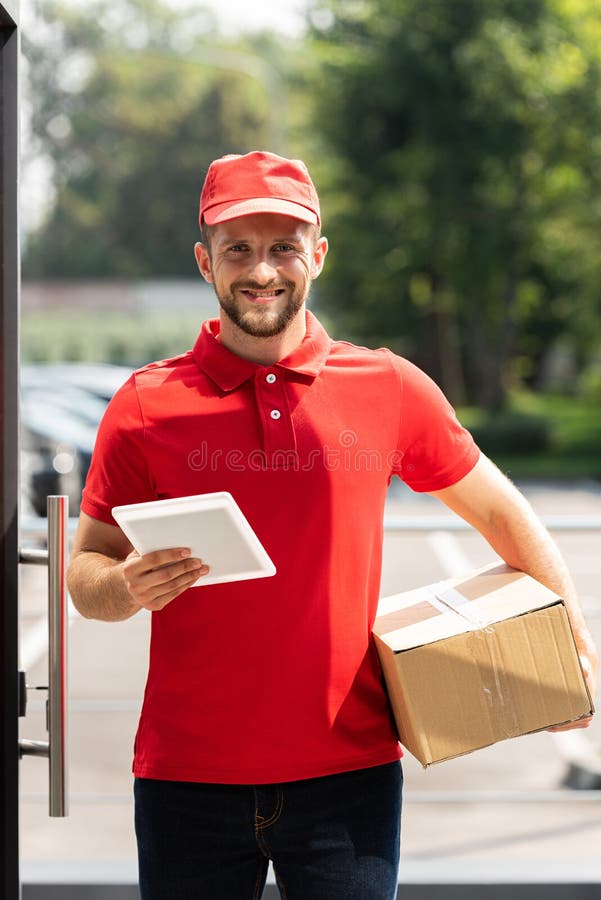 Delivery Man Holding Box and Digital Stock Image - Image of happy ...