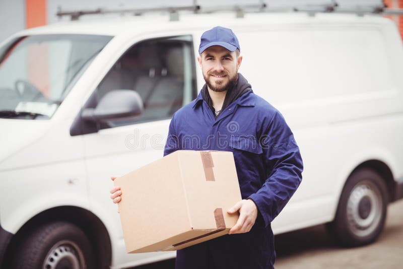 Delivery Man with Parcel Box Stock Photo - Image of postal, delivery ...
