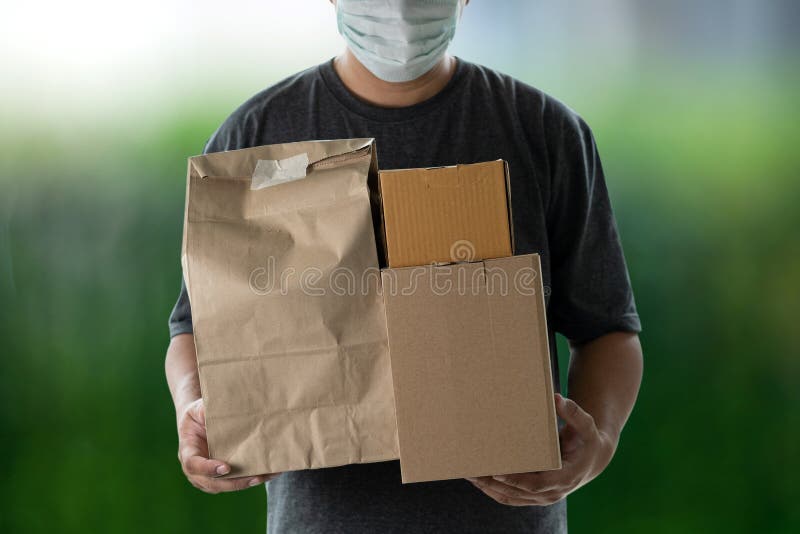 Delivery Man Holding Cardboard Boxes and Accepting Delivery Man in ...