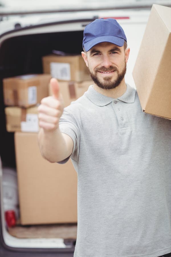 Delivery Man Holding Package Stock Photo - Image of loading, courier ...