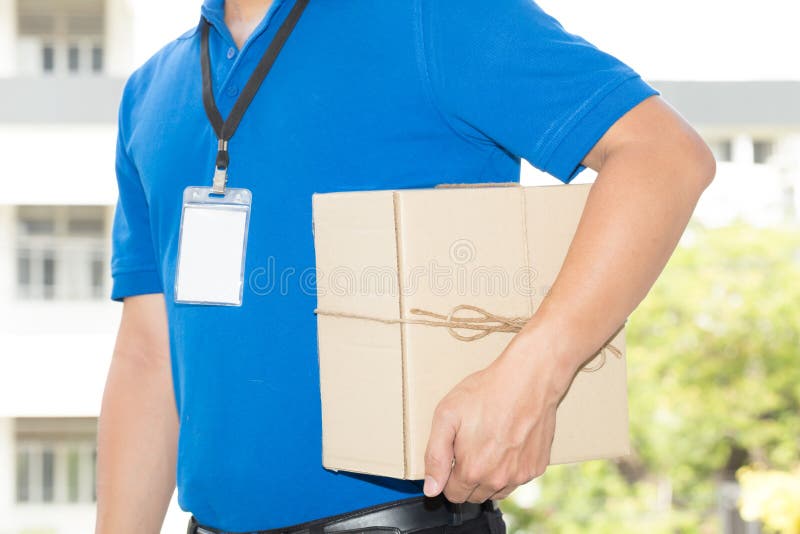 Delivery Man Holding a Parcel Box. Delivery Service Concept Stock Photo ...