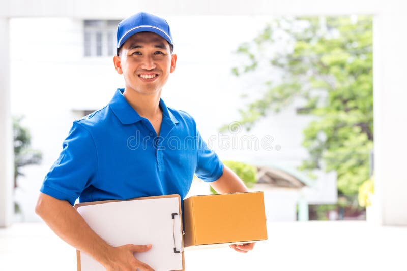 Delivery Man Holding a Parcel Box. Delivery Service Concept Stock Photo ...