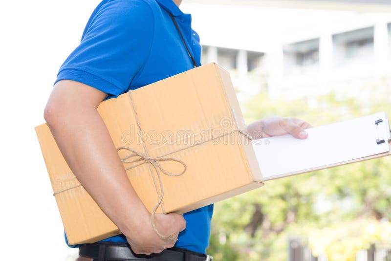 Delivery Man Holding a Parcel Box and White Paper on Clipboard Stock ...