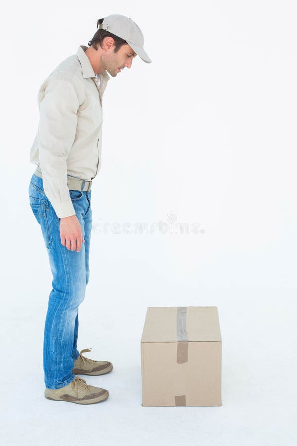 Delivery Man Looking at Cardboard Box Stock Photo - Image of isolated ...