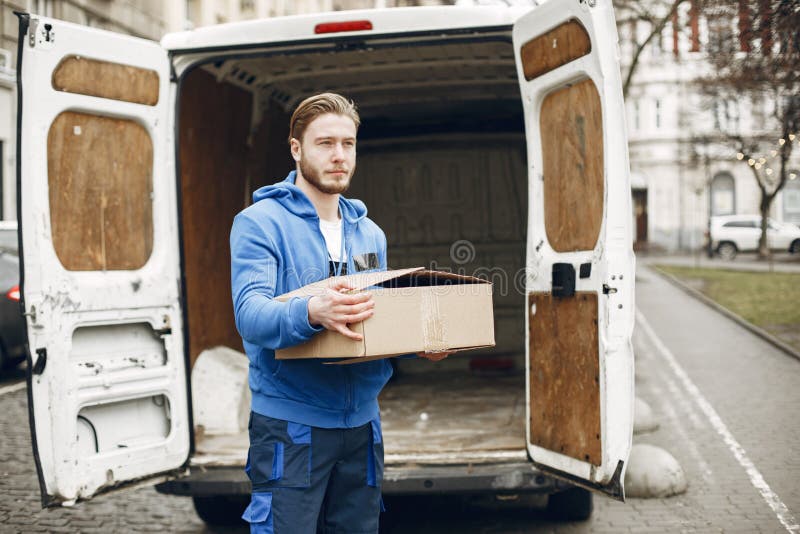 Delivery Man with Package Outdoors Stock Image - Image of transport ...
