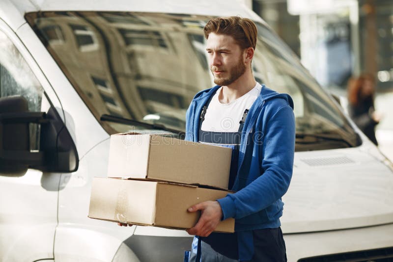 Delivery Man with Package Outdoors Stock Photo - Image of outdoors ...