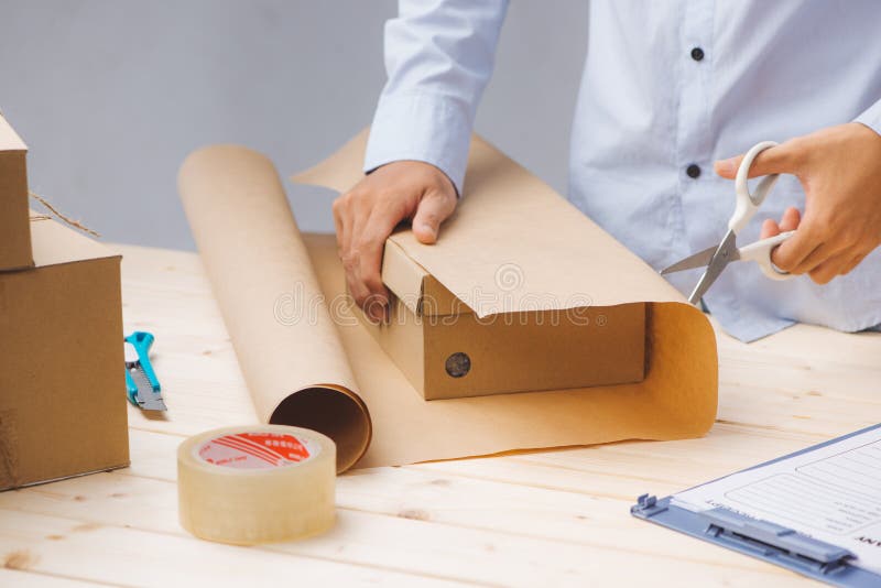 Delivery Man Packing Up on Work Place in Post Office Stock Photo ...