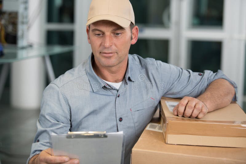 Delivery Man with Parcels and Clipboard Stock Image - Image of planning ...