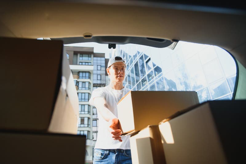 Delivery Man Picking Up Box from Car Stock Photo - Image of business ...